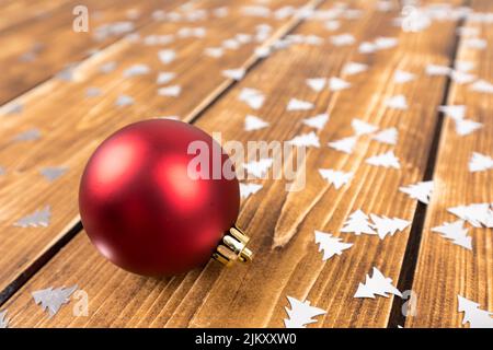 A closeup shot of a wooden Christmas tree decoration on a white ...