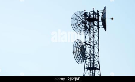 Pylon with round satellite dishes for transmission and repetition of TV ...