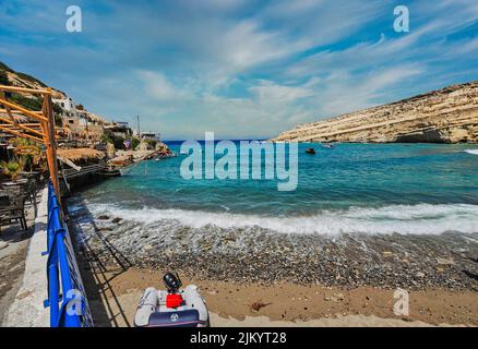 Matala, beautiful beach on Crete island, waves and rocks. Panorama ...
