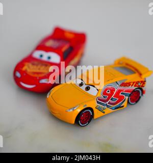 A selective focus shot of the Mattel Cruz Ramirez toy model race car ...
