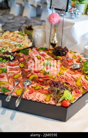 A vertical closeup shot of a buffet table Stock Photo - Alamy
