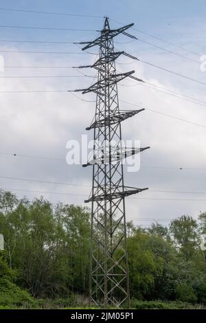 a vertical shot of High voltage pylon for power supply Stock Photo - Alamy