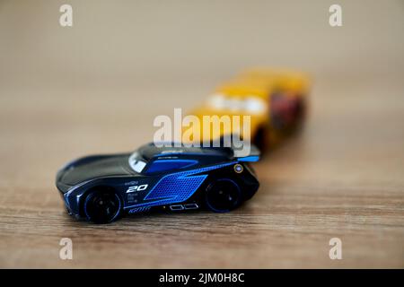 The Mattel toy model cars from the Disney Pixar Cars movie on a playmat ...