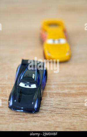 The Mattel toy model cars from the Disney Pixar Cars movie on a playmat ...
