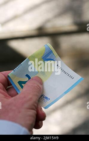 20 euro banknote close up, yellow background for business finance ...