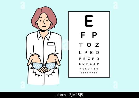 Female ophthalmologist holding glasses on background eye check chart ...