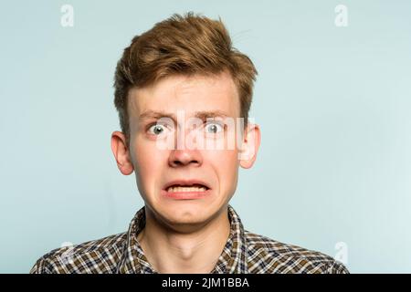 awkward gawky fumbling dorky man facial expression Stock Photo - Alamy