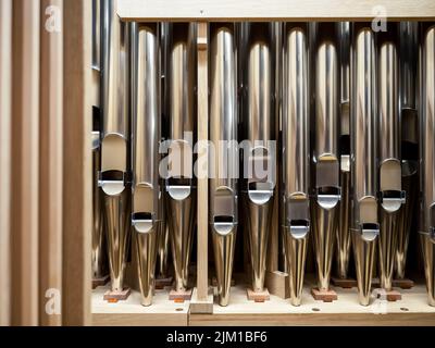 modern steel organ pipes, structure of organ, musical instrument. close ...