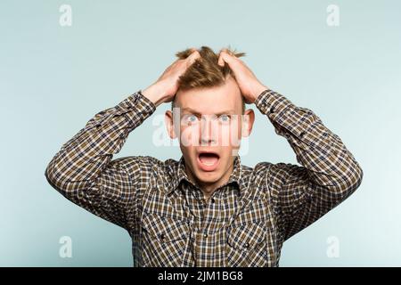 sad worried distraught man pull hair out emotion Stock Photo - Alamy