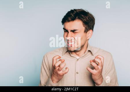 uncontrollable anger helplessness despair man face Stock Photo - Alamy