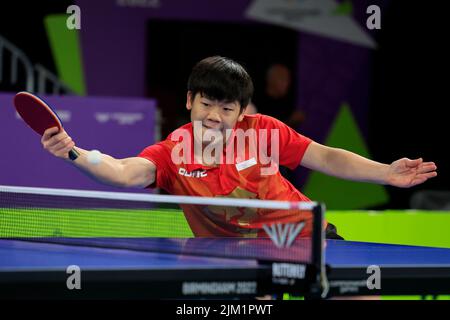 Izaac Quek of Singapore returns the serve of Shaun Jones of South ...