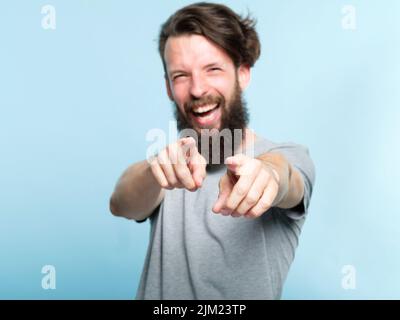 mockery laughing grinning man point finger sneer Stock Photo - Alamy