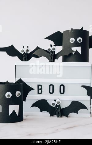 Boo! halloween lightbox message with black scary bats Stock Photo - Alamy