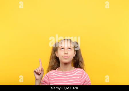 look above girl point index finger virtual object Stock Photo - Alamy