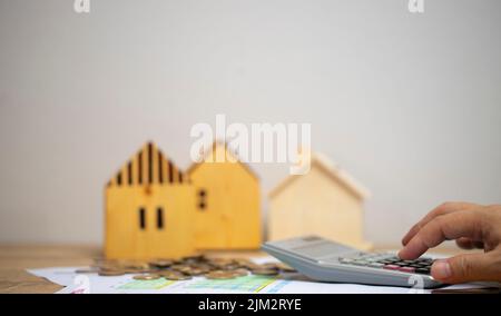 pile of money coins with graph paper on wood table, concept in account ...