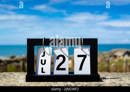 Date 27 July in a frame on the calendar, mockup, copy space. Calendar ...
