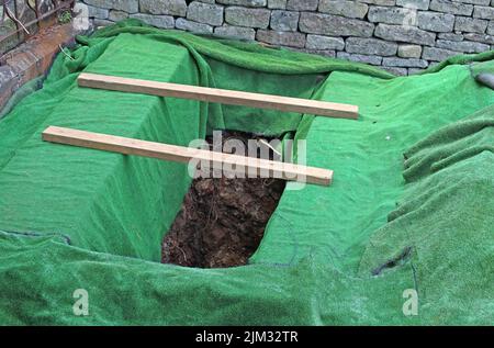Freshly dug grave plot, chapel graveyard, cemetery, Eastcombe ...