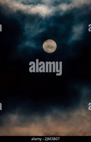 A bright full moon shines through the trees on a chilly spring night Stock Photo - Alamy