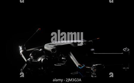 Drone DJI Mavic 3 after crashed on a black background. Drone after ...