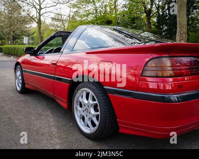 mitsubishi eclipse targa in red. It's an old car with a targa roof ...
