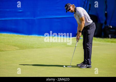 Patrick Rodgers lines up his putt on the first green during the final ...