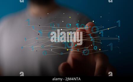 A hand pointing to digital binary codes - the concept of lines and ...