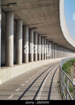 A beautiful shot of the design and columns of a big concrete bridge ...