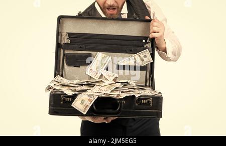cropped millionaire holding case full of dollar cash isolated on white ...