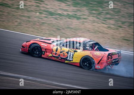 Red Chevrolet Corvette C5 drifting in the track Stock Photo - Alamy