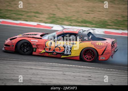 Red Chevrolet Corvette C5 drifting in the track Stock Photo - Alamy