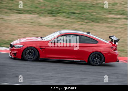 BMW F82 M4 GTS racing on the circuit Stock Photo - Alamy