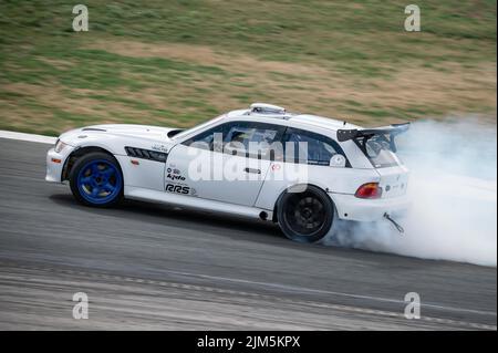 White BMW Z3 coupe E36 7 drifting on the circuit Stock Photo - Alamy