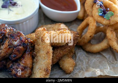 a set of different types of products fried together, French fries ...