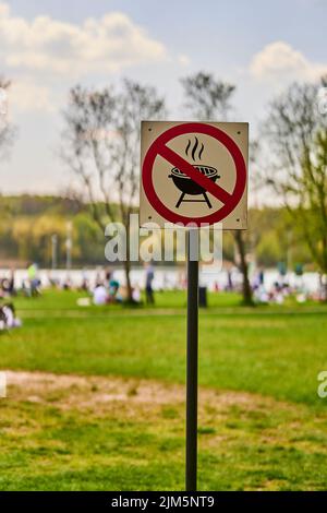 Warning sign with a barbecue grill forbidden to grill Stock Photo - Alamy