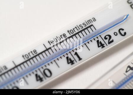 Clinical thermometer in analog form. Mercury thermometer on white ...