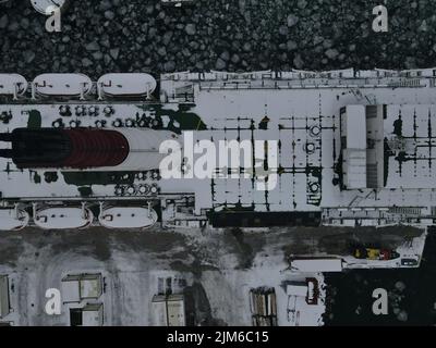A top view of a big ship covered with snow in a frozen water Stock ...