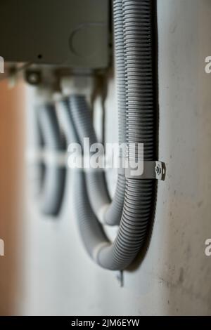 A vertical shot of an Inea cable internet installation box attached on ...