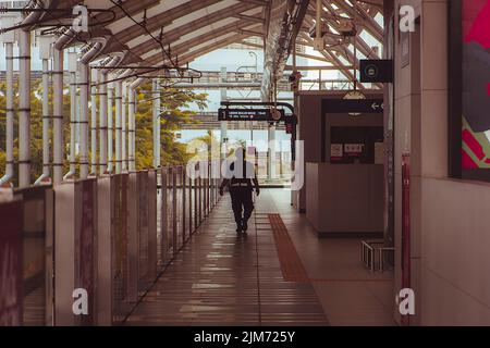 An officer walking trough by the subway station Stock Photo - Alamy