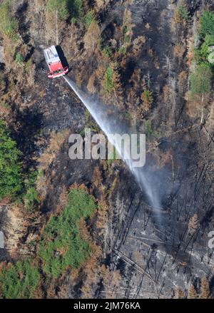 Bad Schandau, Germany. 03rd Aug, 2022. Flames blaze at an ember during ...