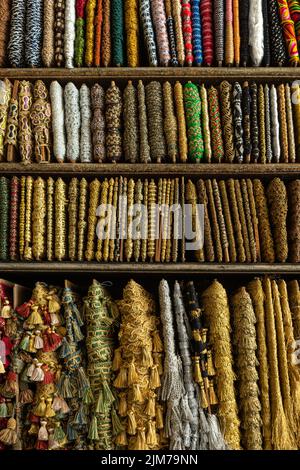multi-colored braid on the counter of the store for decoration, sewing ...