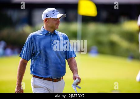 August 4, 2022: Bill Haas walks off after making par on the 9th during ...