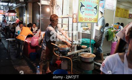 People sitting at a fast food at night, Yurakucho Yakitori Alley, Ginza ...