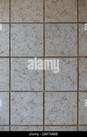 A hole in a beige floor tile, close up of damage Stock Photo - Alamy