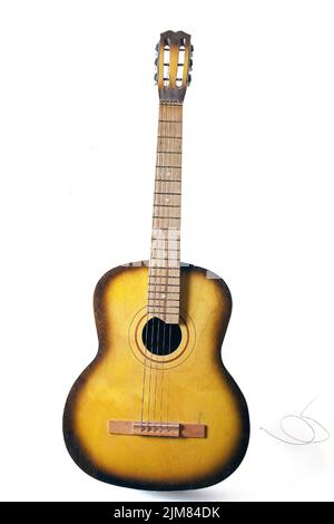 A guitar with a broken guitar string Stock Photo - Alamy
