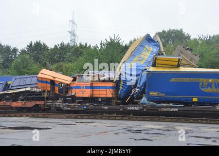 Freight wagons are standing in line at the railway station Stock Photo ...