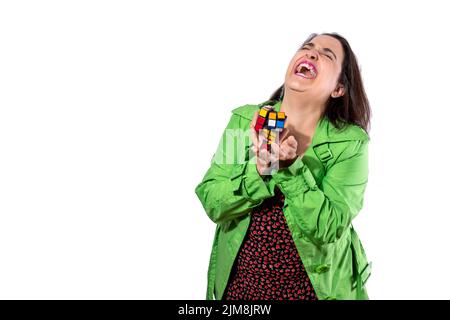 girl laughing after breaking the rubik's cube. white background Stock ...