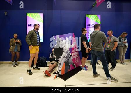 Spectators are held outside during a delay in play to inspect a health ...