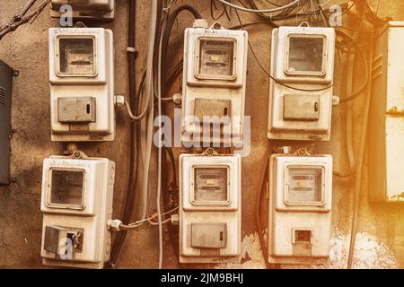 Various Electric Meters Stand A Row. Energy Consumption Concept. Impact ...