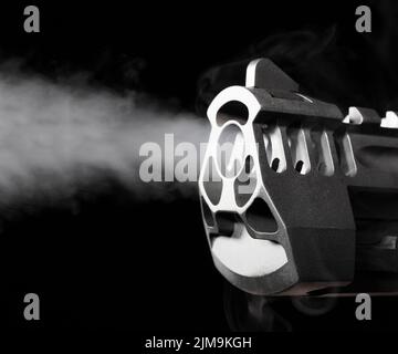 Smoking gun - smoke coming out of barrel of gun after bullet has been ...