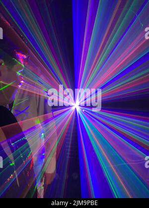 Colorful laser light beam photographic effect on black background ...